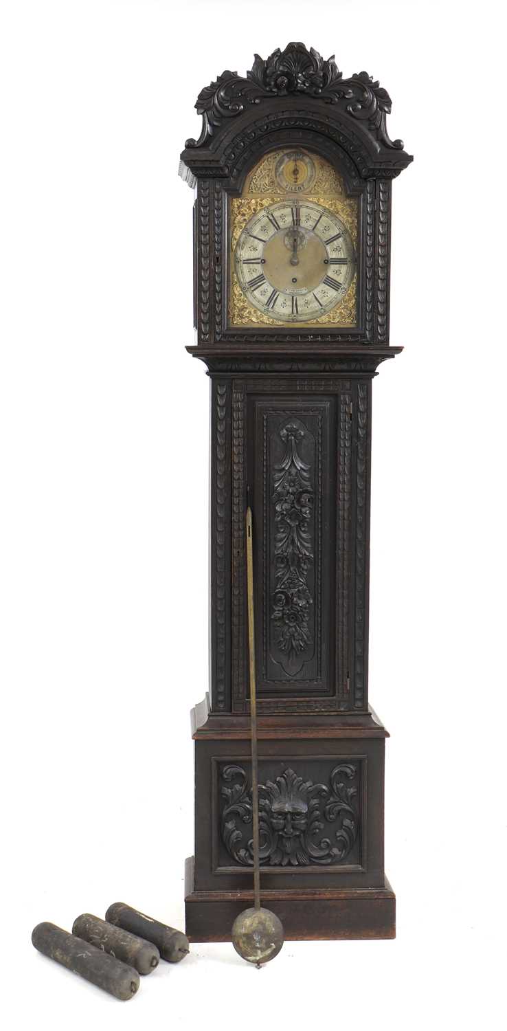 Lot 245 - A Finnigans oak longcase clock,