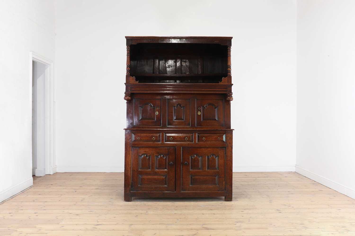 Lot 403 - A joined oak cwpwrdd tridarn,