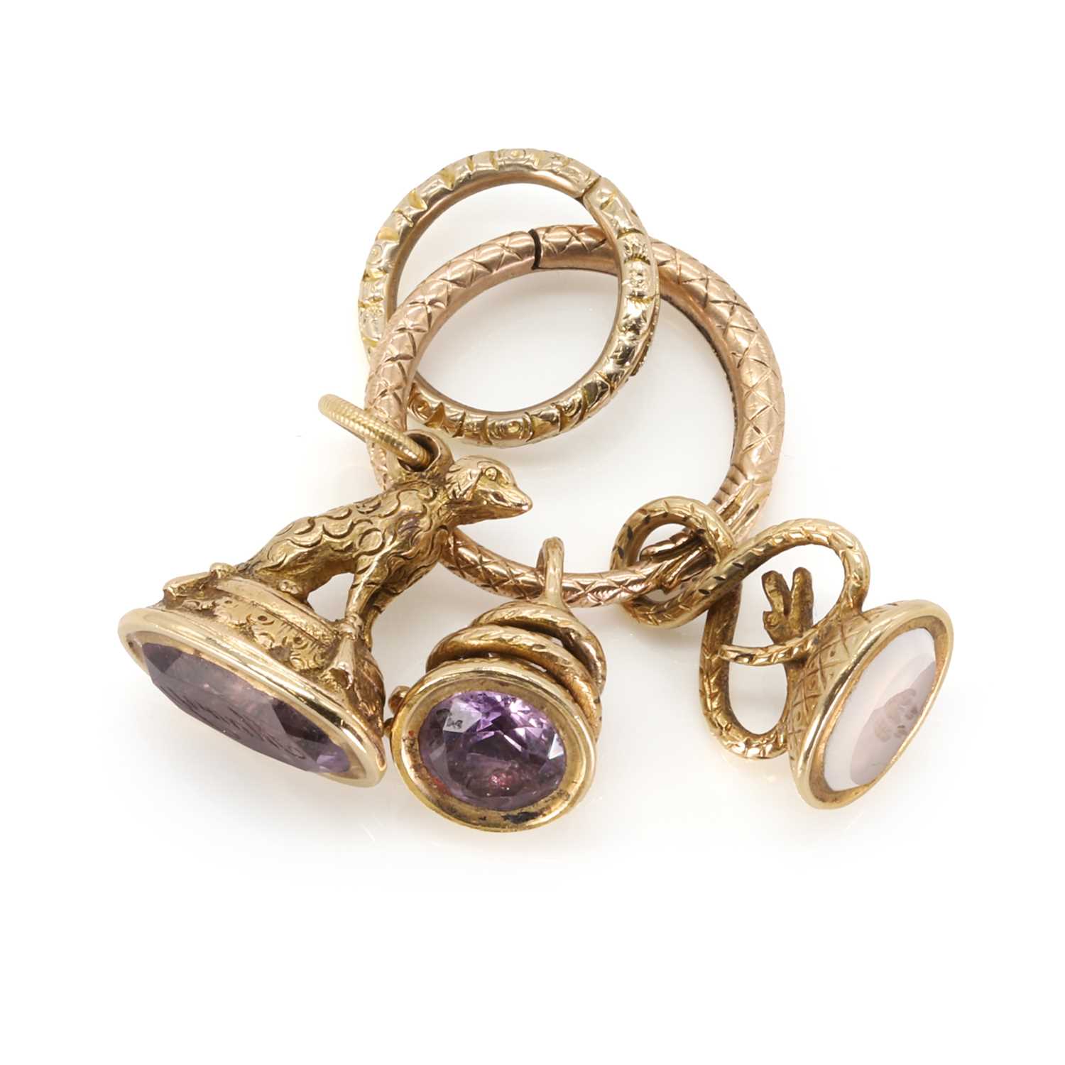 Lot 357 - A group of antique fob seals suspended by an