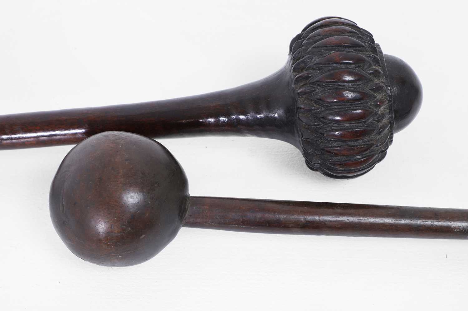 Lot 377 - Two Oceanic wooden throwing clubs,