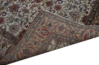 Lot 431 - A cream ground carpet,