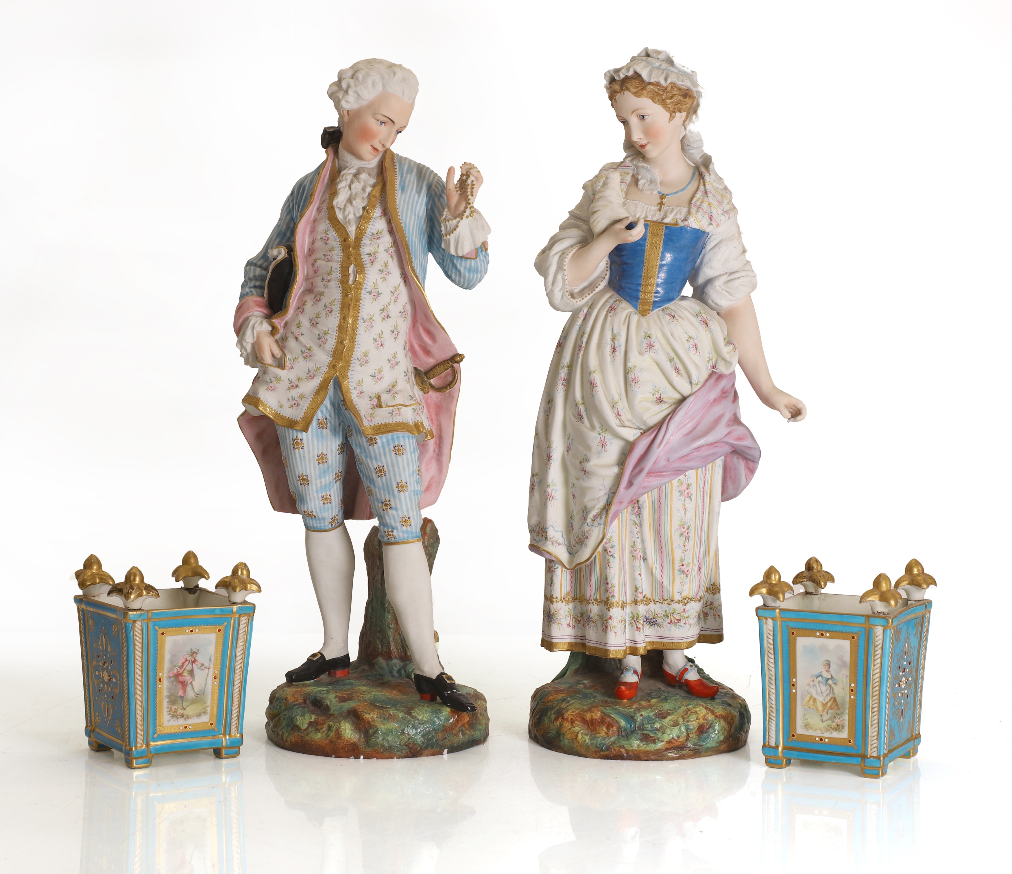 Lot 122 - A pair of Continental bisque figures of a